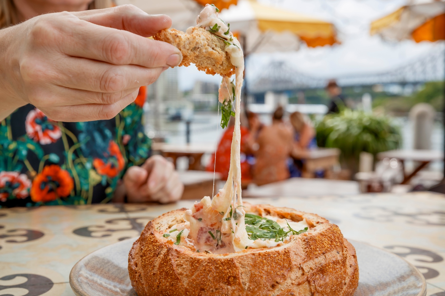 Warm up with pizza cob loaf at this riverside fave all July long ...